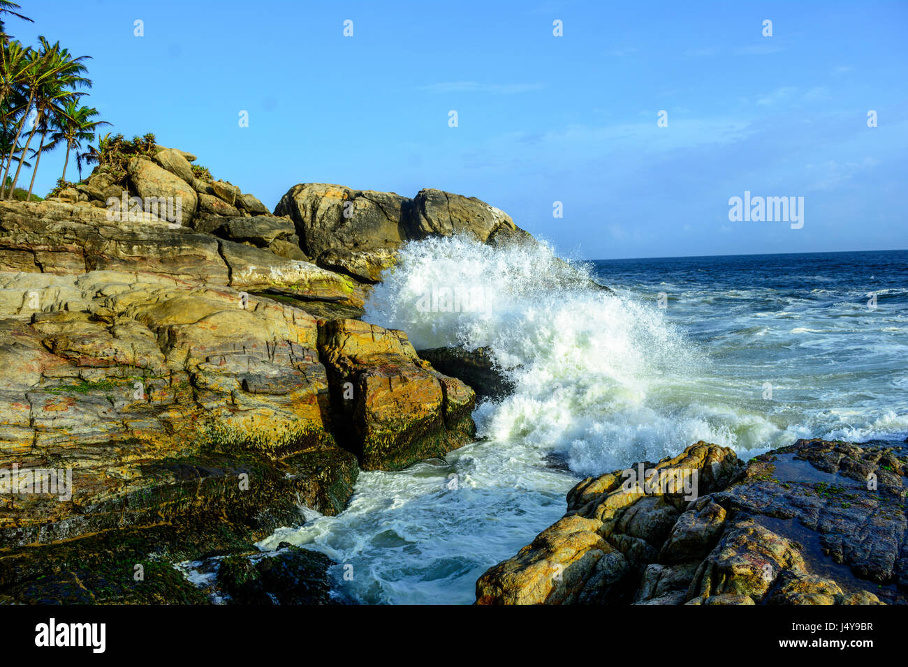waves washing over Rocks Kerala Indian ocean Stock Photo - Alamy