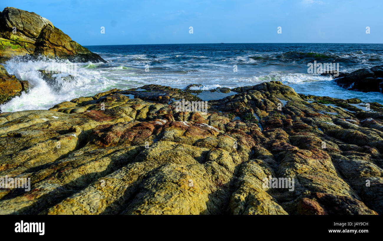 waves washing over Rocks Kerala Indian ocean Stock Photo - Alamy