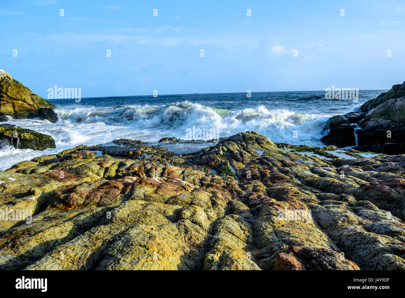 waves washing over Rocks Kerala Indian ocean Stock Photo - Alamy