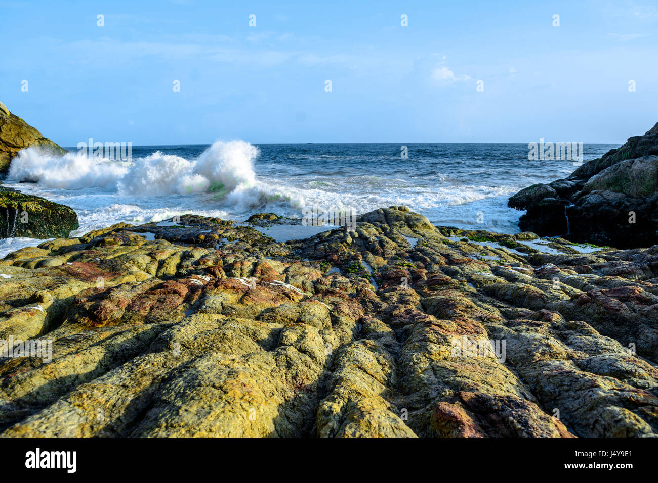 waves washing over Rocks Kerala Indian ocean Stock Photo - Alamy