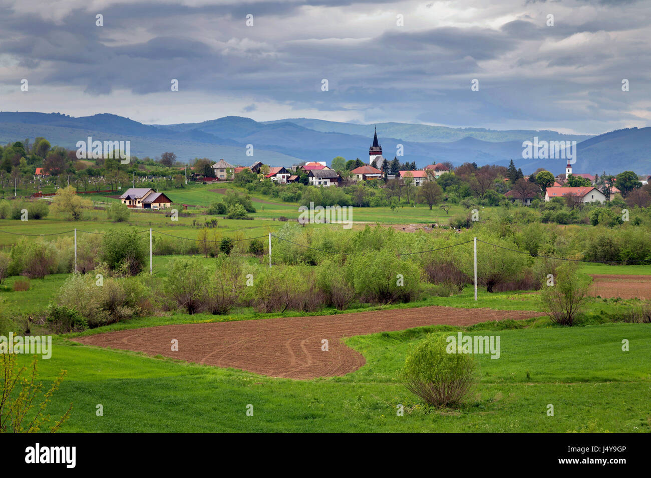 Springtime landscape of the Transylvanian village Stock Photo - Alamy