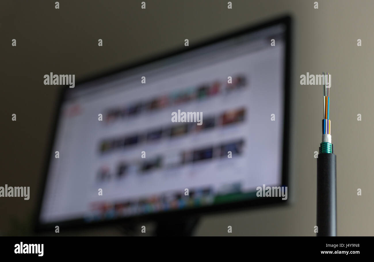 Fiber Optics Cable - Fiber To The Home internet. Blurry background in ...