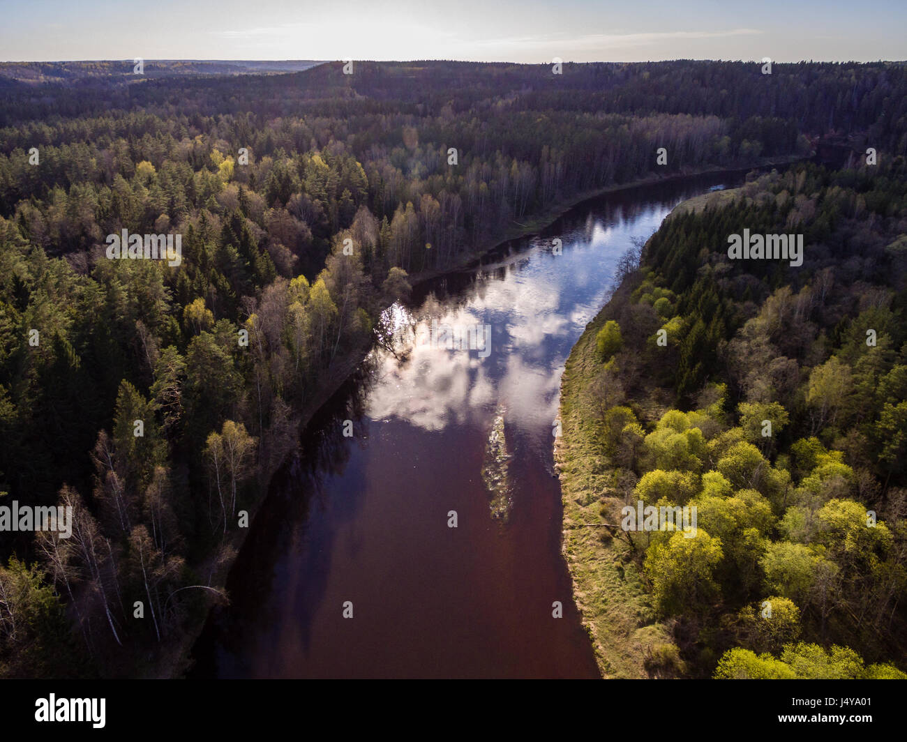 drone image. aerial view of rural area with river and broken cloud ...