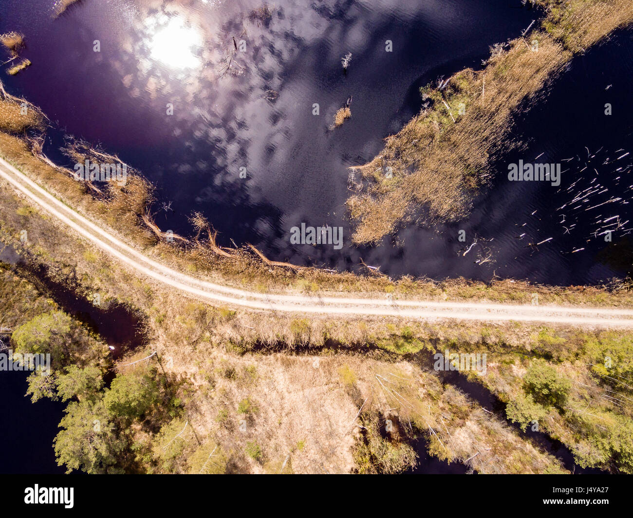 drone image. aerial view of rural area with swamp lakes with blue water ...