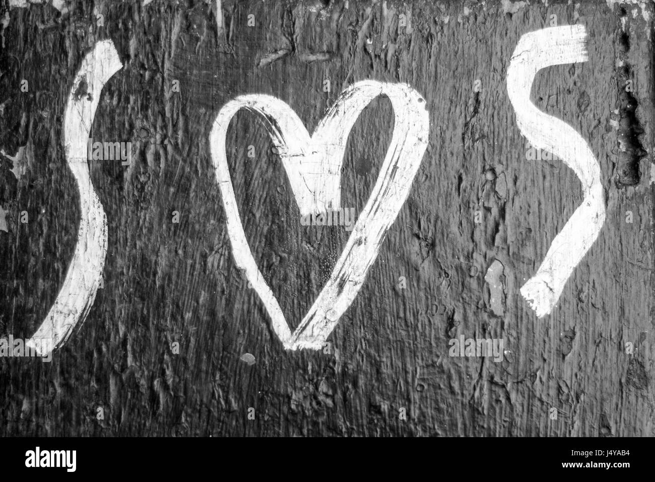 SOS sign on a surface Stock Photo - Alamy