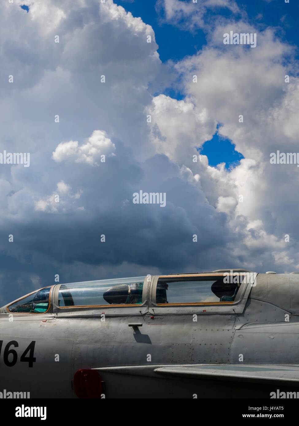 MiG-21 two-seater and sunshine cloudy sky Stock Photo - Alamy