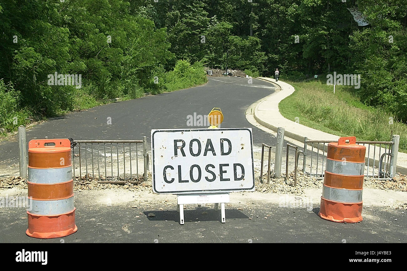 A blockade of road construction items, bicycle racks and concrete ...