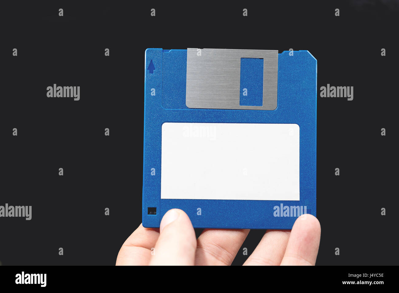 Computer floppy disk in Hand on black background Stock Photo - Alamy