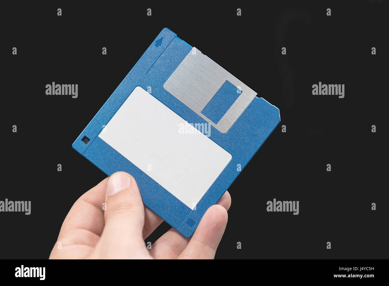 Computer floppy disk in Hand on black background Stock Photo - Alamy