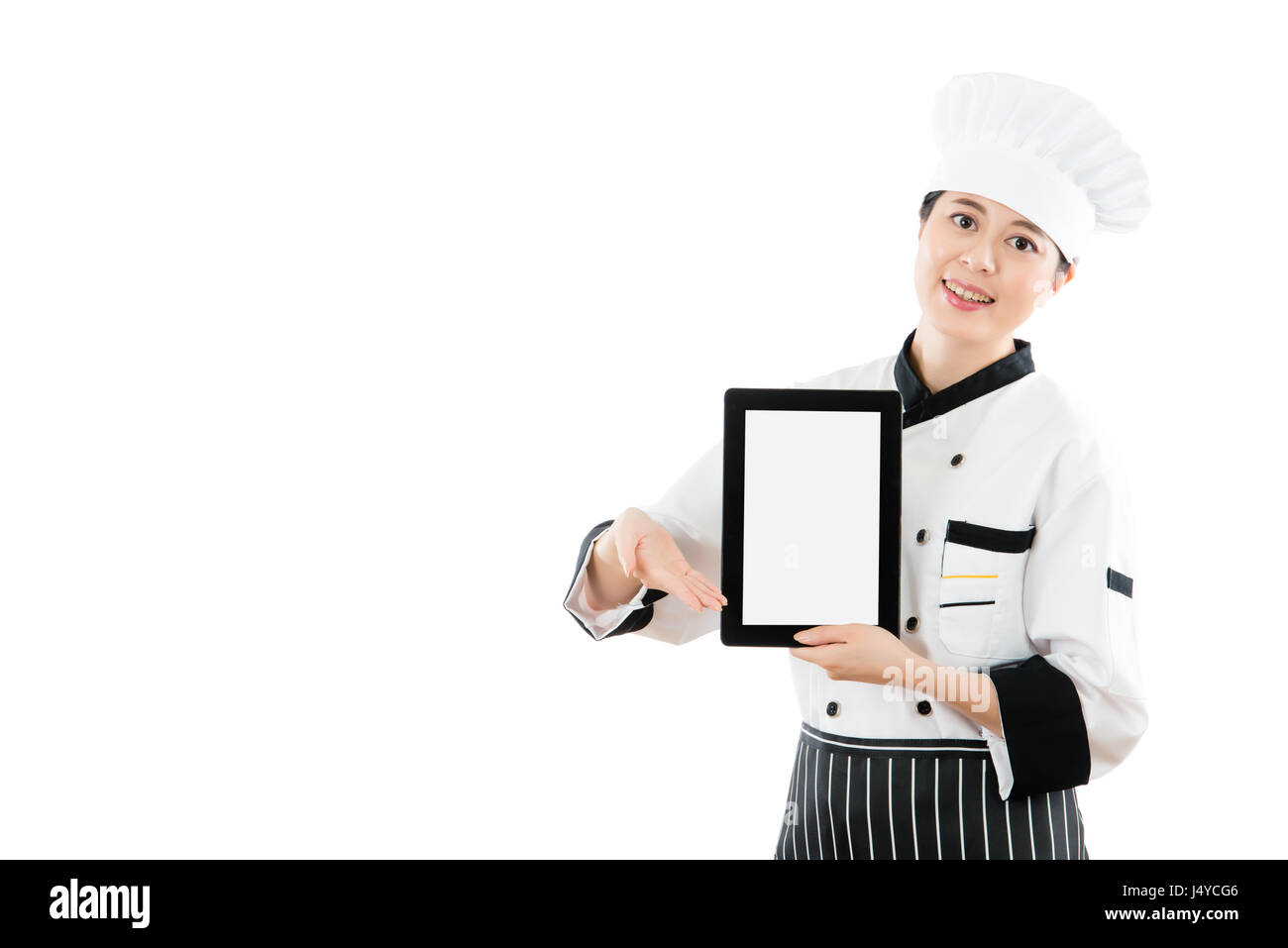 Portrait of a happy asian woman female chef cook showing blank tablet ...