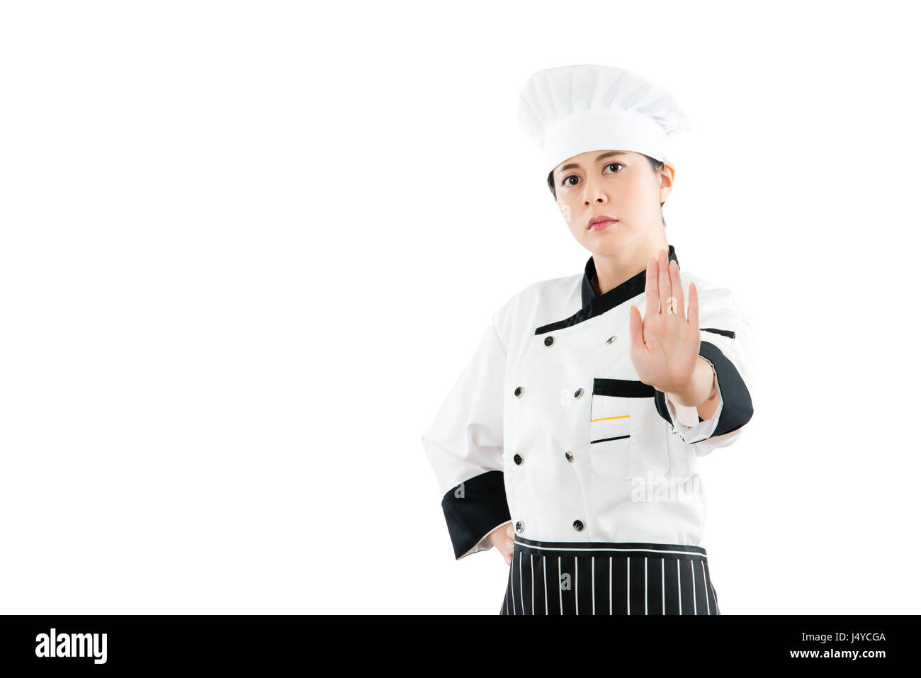 serious asian woman chef making stop reject sign hand gesture with copy ...