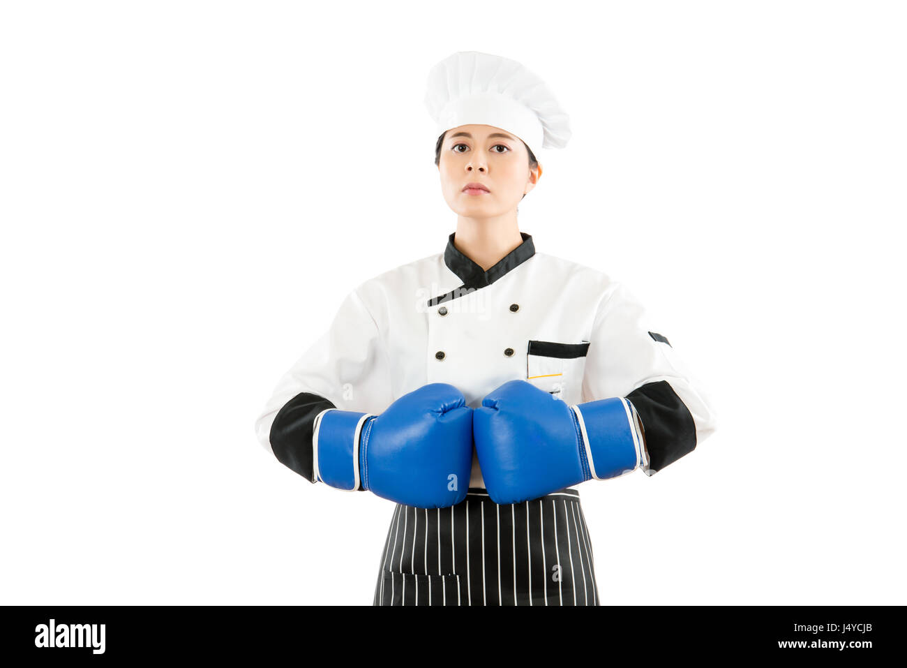 aggressive young mixed race chinese asian chef punching blue boxing ...
