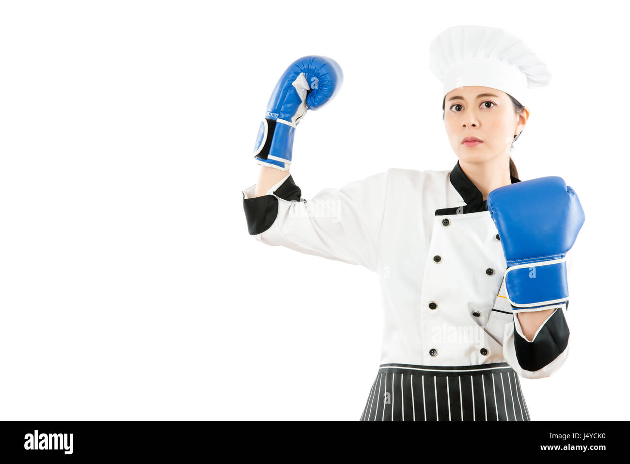 powerful strong pretty cooking woman arm up showing muscle with blue ...