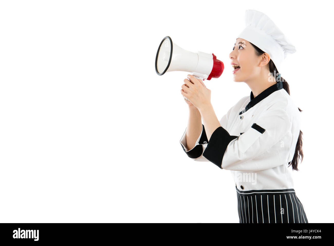 asian beautiful chef standing on the white wall background talking to ...