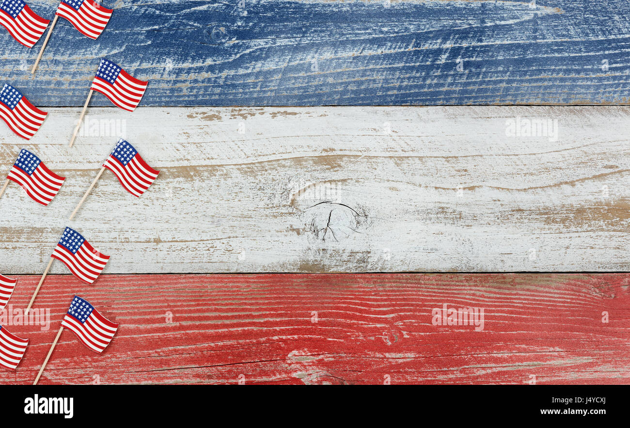 Flay lay view of USA mini flags on rustic wooden boards painted in red ...