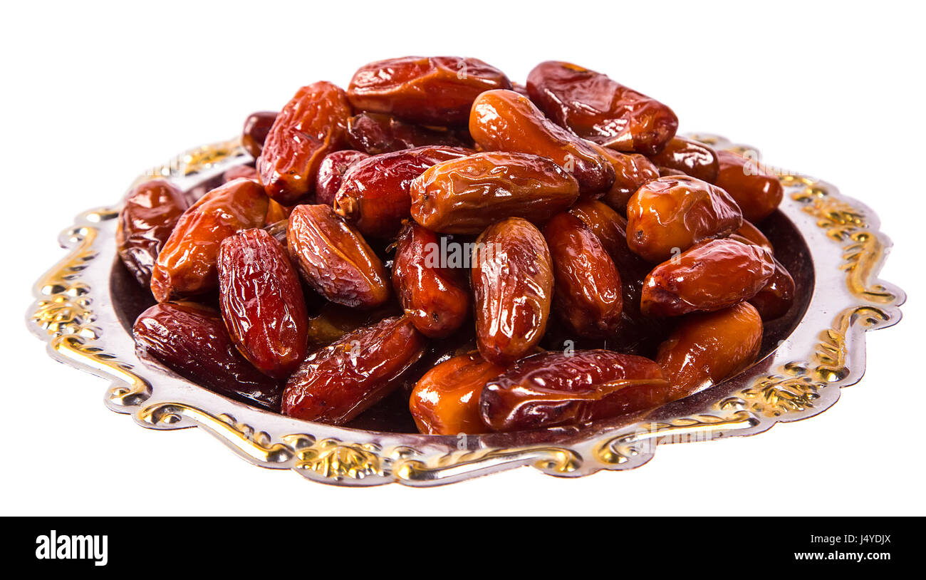 Beautiful Dates fruit on a silver tray isolation on white background ...