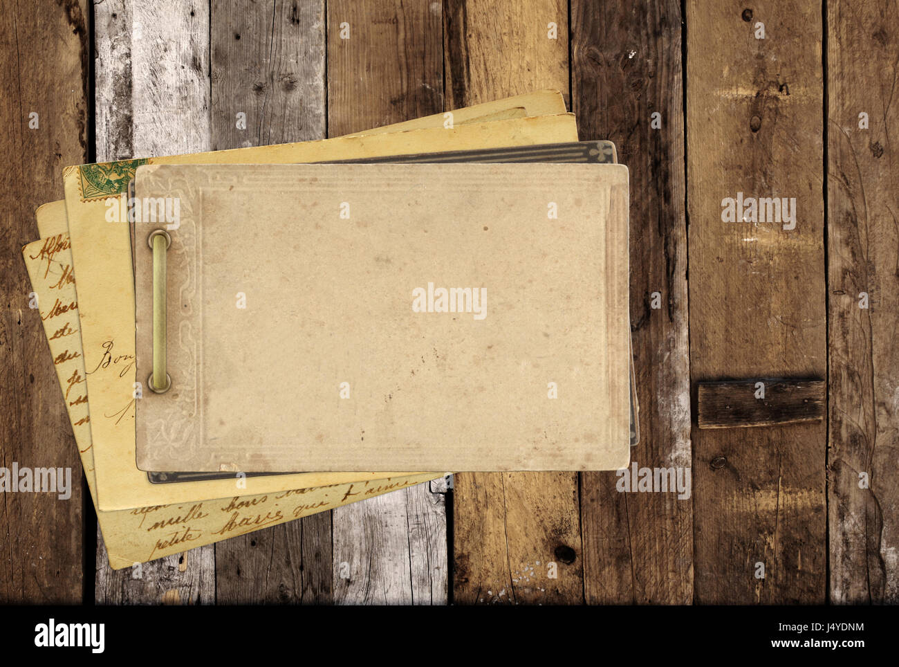 Vintage post cards on old wooden boards of brown colors. Background in ...