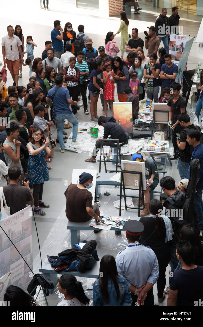 People watching the Art 25 live painting competition in Labim Mall ...