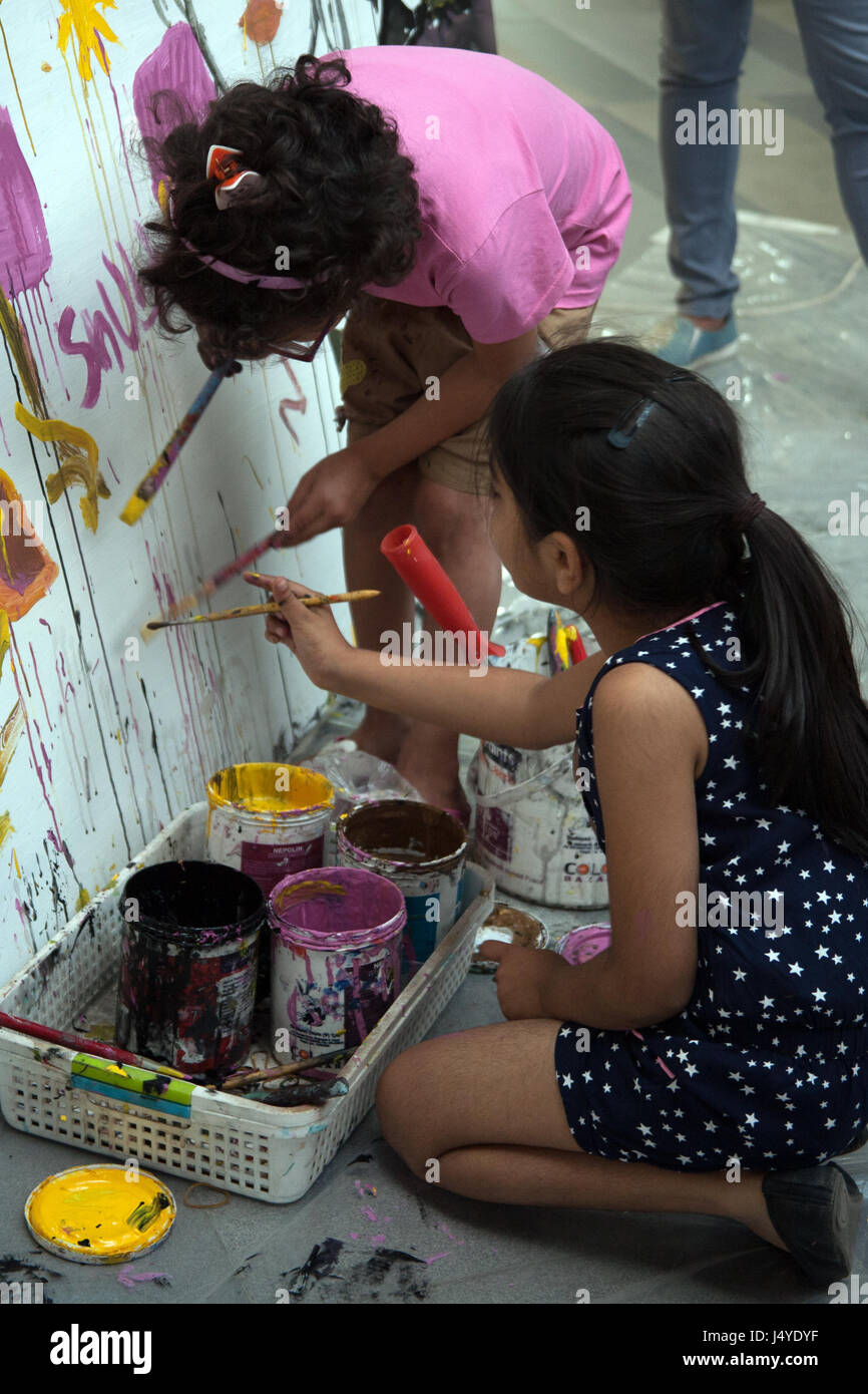 Children painting as part of the Art 25 live painting competition in ...