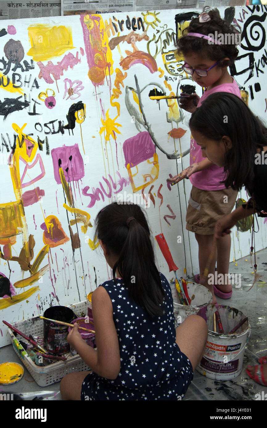 Children painting as part of the Art 25 live painting competition in ...