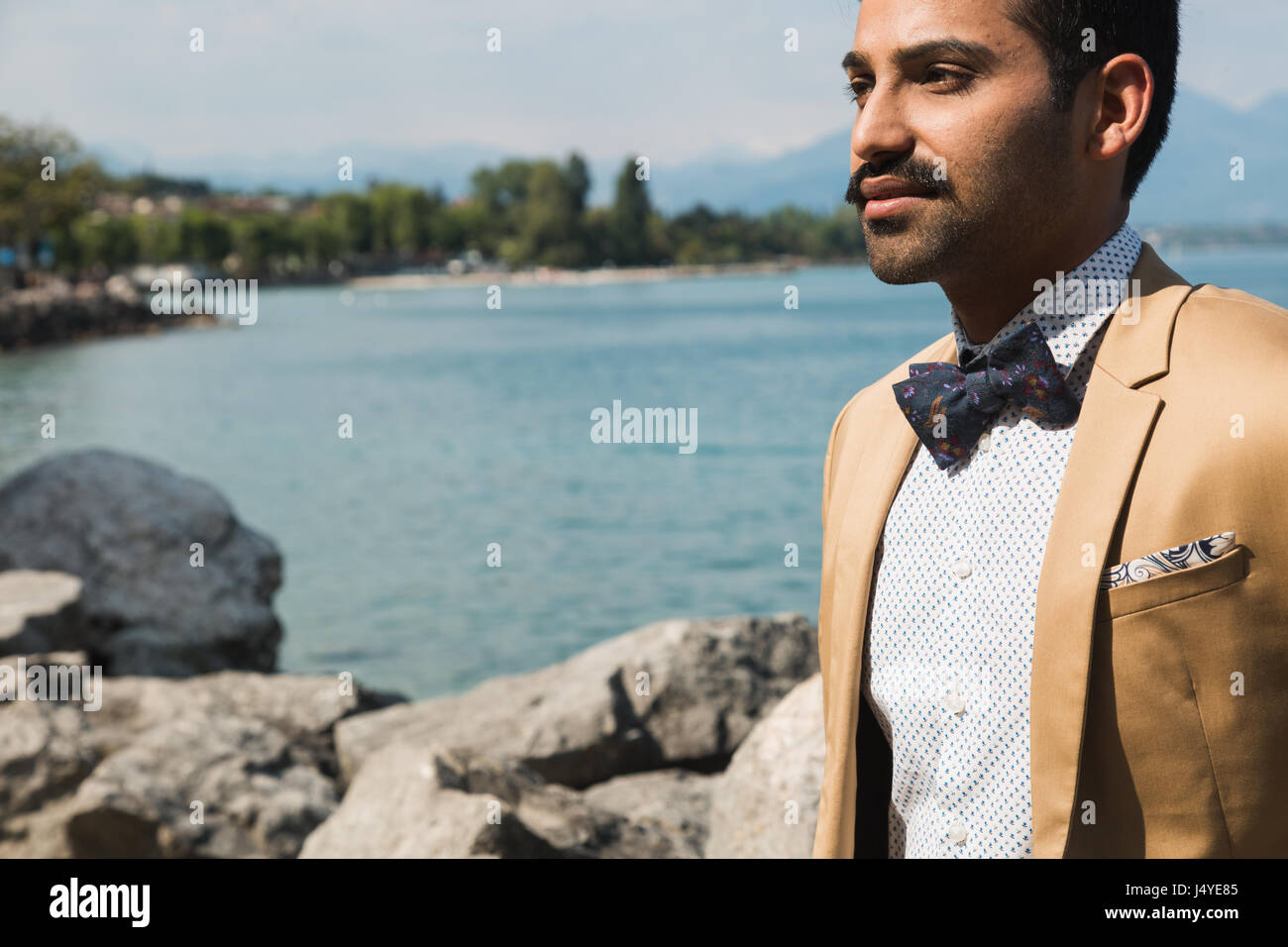 Handsome Indian man posing in a vacation context. Street fashion and ...