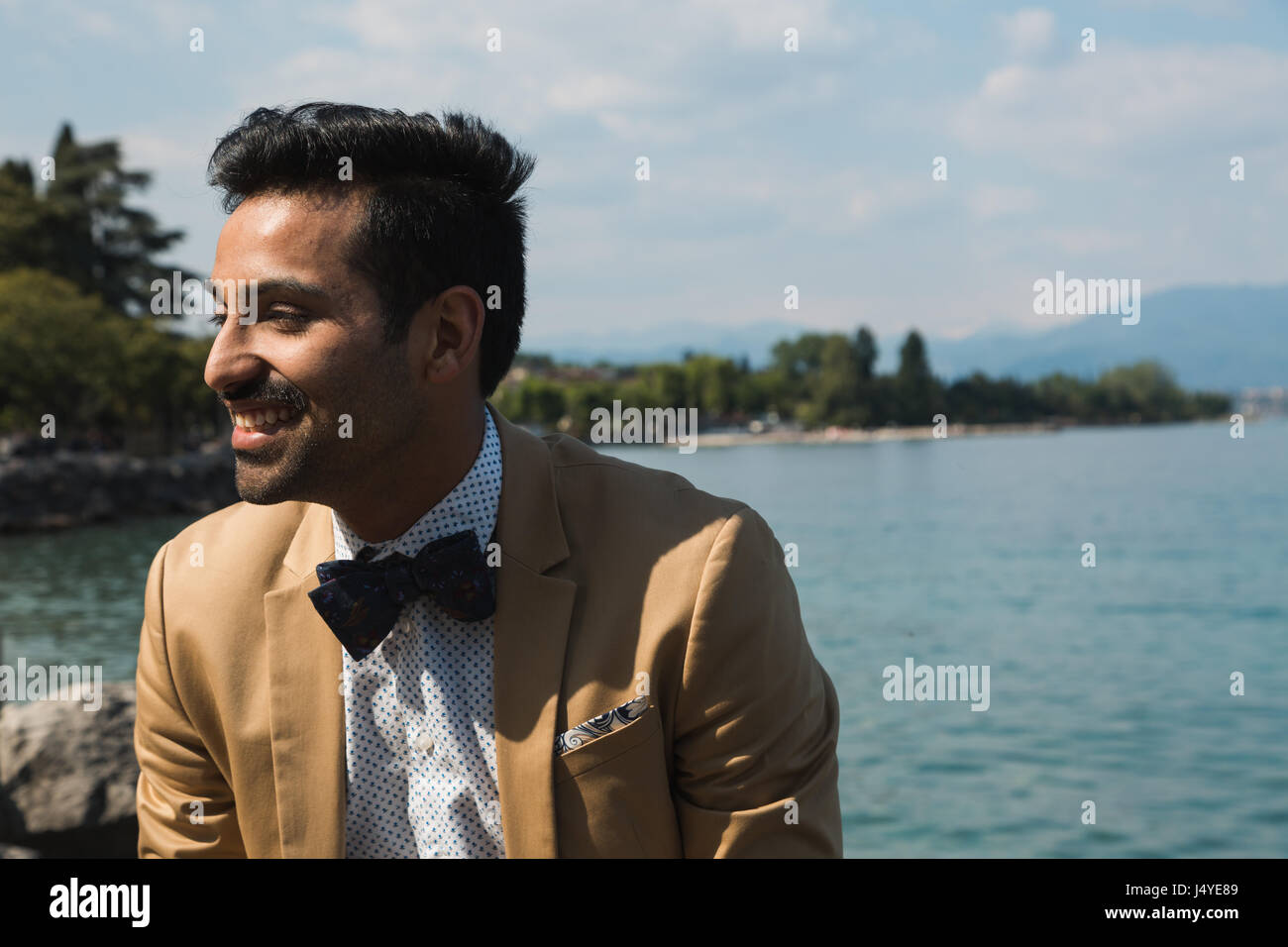 Handsome Indian man posing in a vacation context. Street fashion and ...