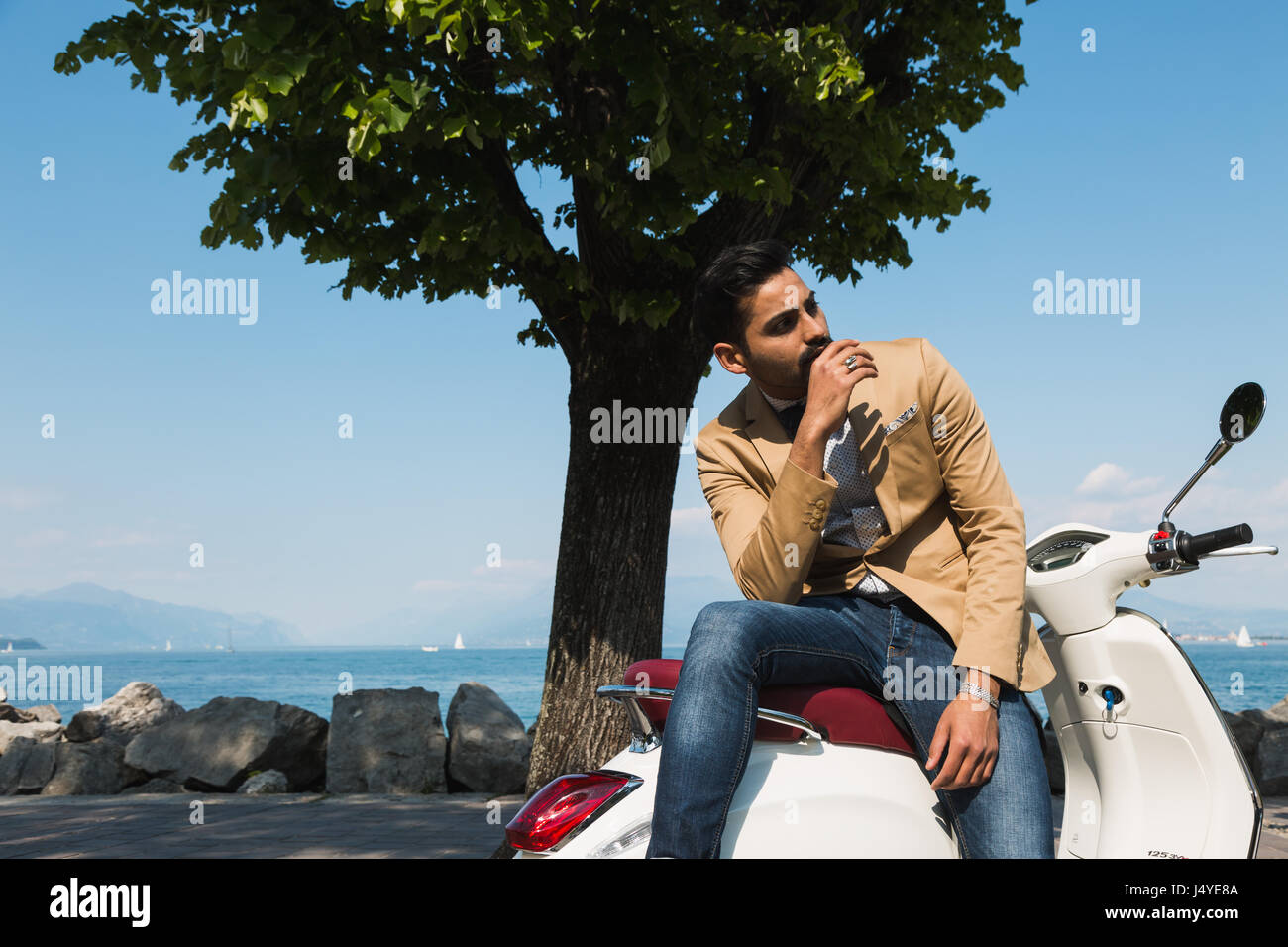 Handsome Indian man posing in a vacation context. Street fashion and ...
