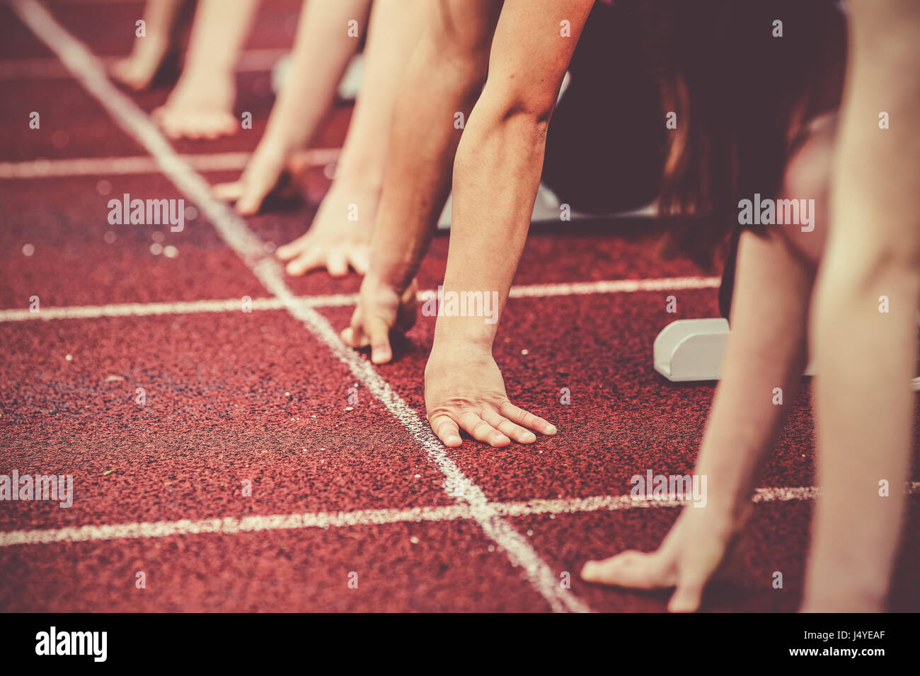 hands on starting line Stock Photo - Alamy