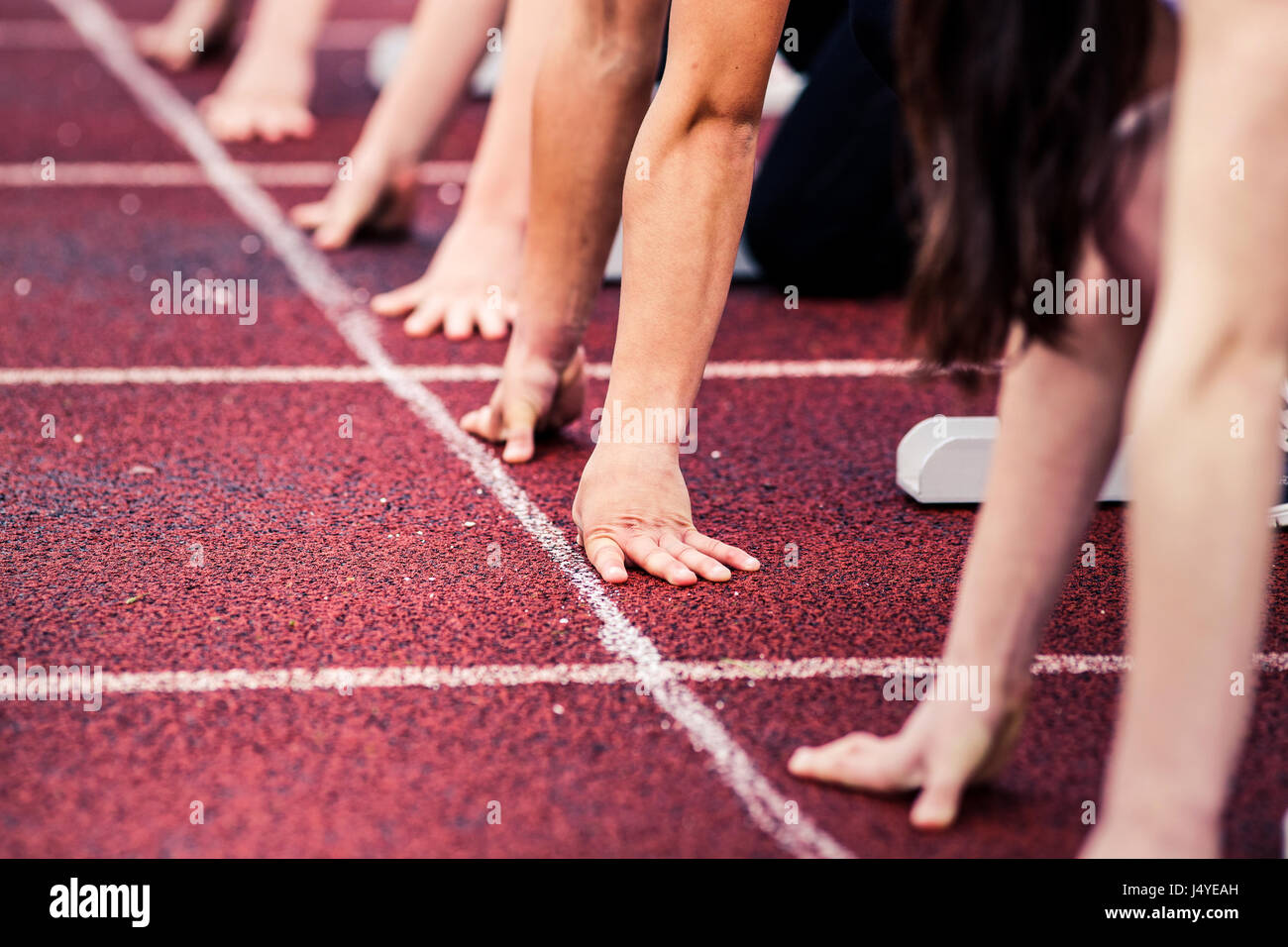 hands on starting line Stock Photo - Alamy