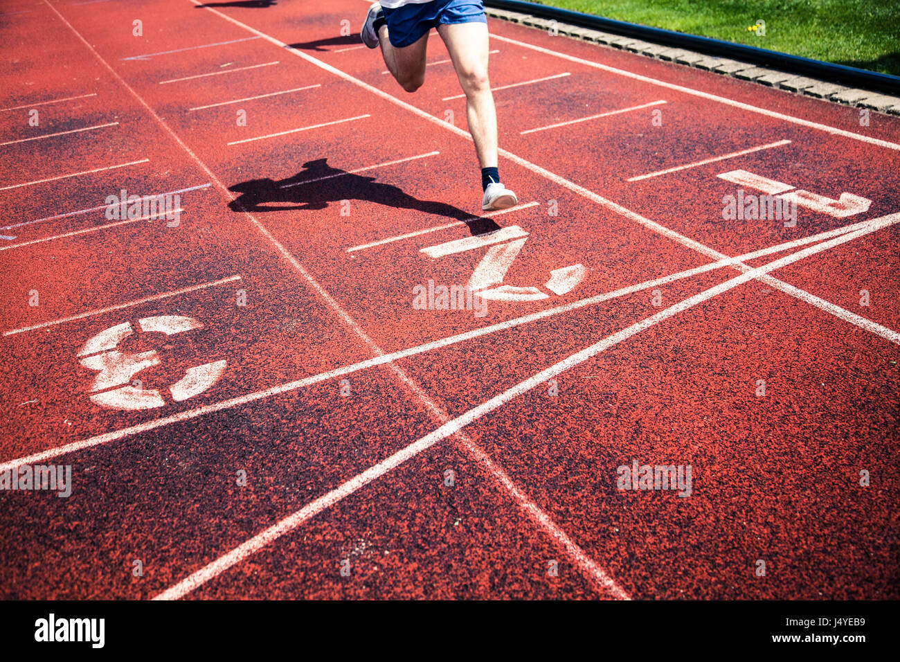 runners approaching the finish line of a race Stock Photo - Alamy