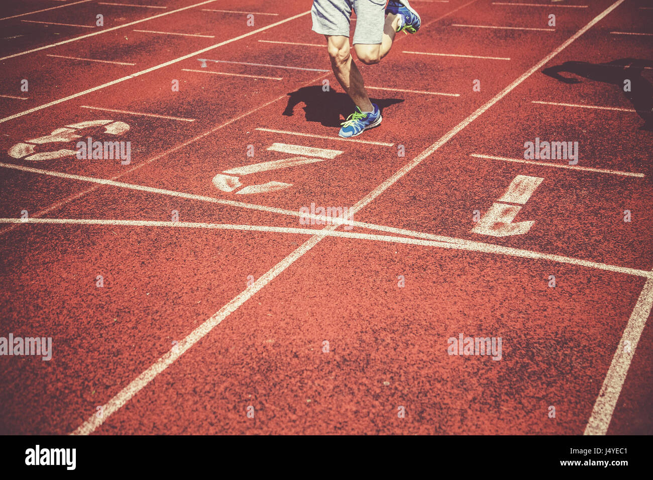 runners approaching the finish line of a race Stock Photo - Alamy