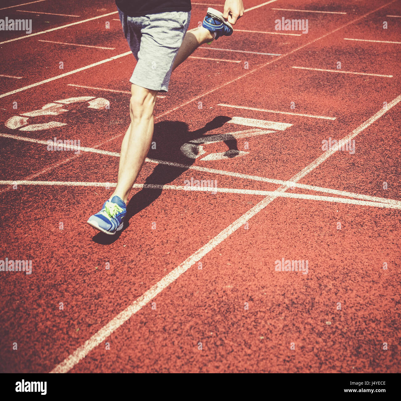 runners approaching the finish line of a race Stock Photo - Alamy