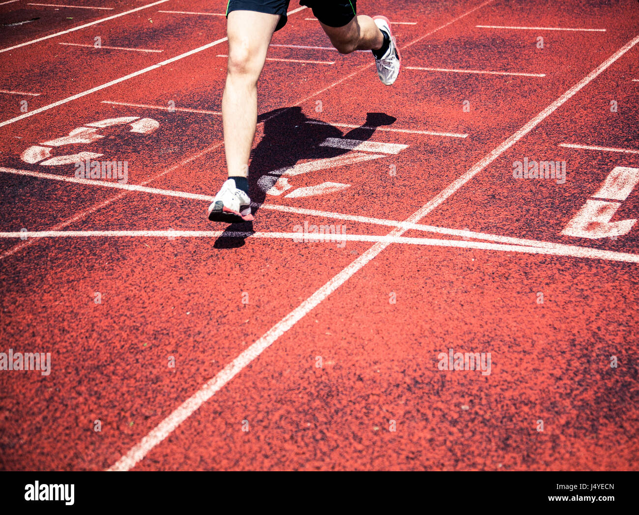 runners approaching the finish line of a race Stock Photo - Alamy