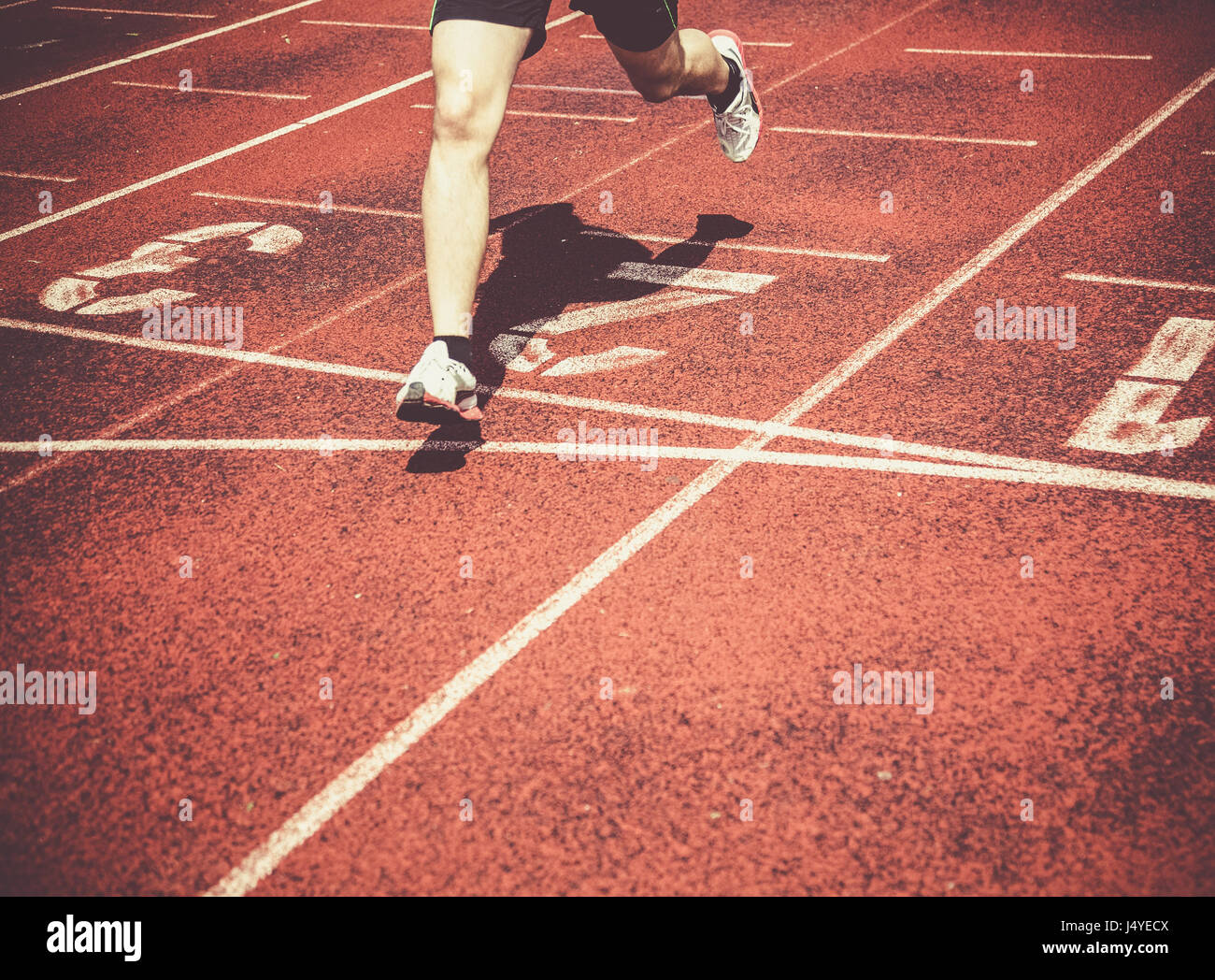 runners approaching the finish line of a race Stock Photo - Alamy