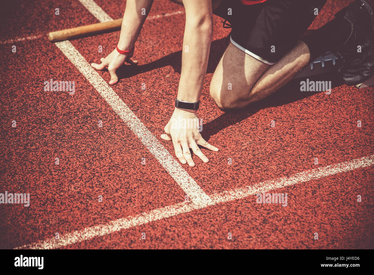 hands on starting line Stock Photo - Alamy