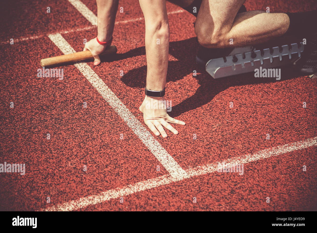 hands on starting line Stock Photo - Alamy