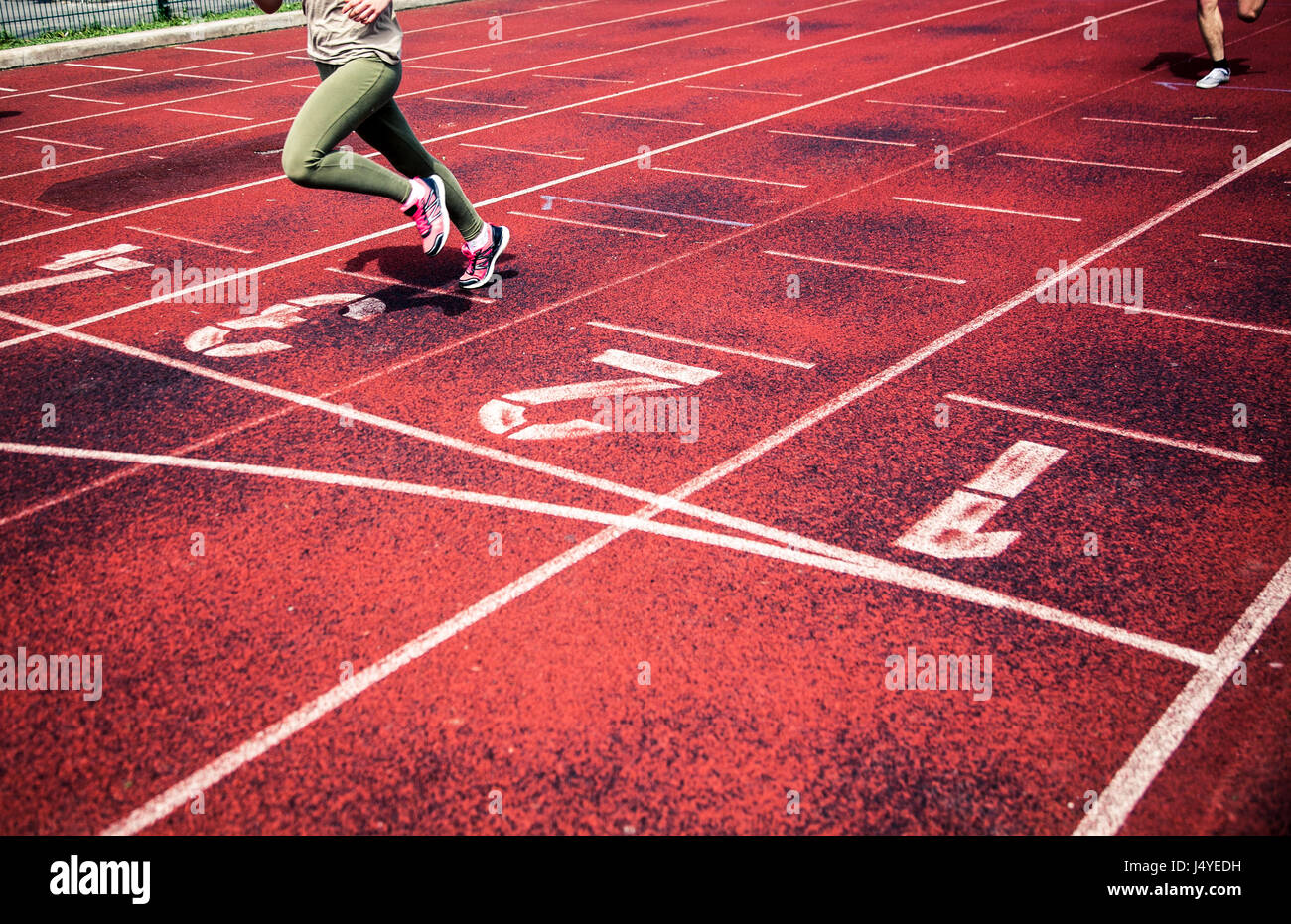 runners approaching the finish line of a race Stock Photo - Alamy