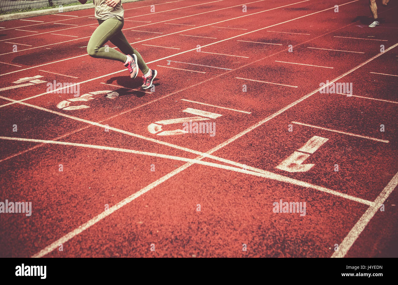 runners approaching the finish line of a race Stock Photo - Alamy