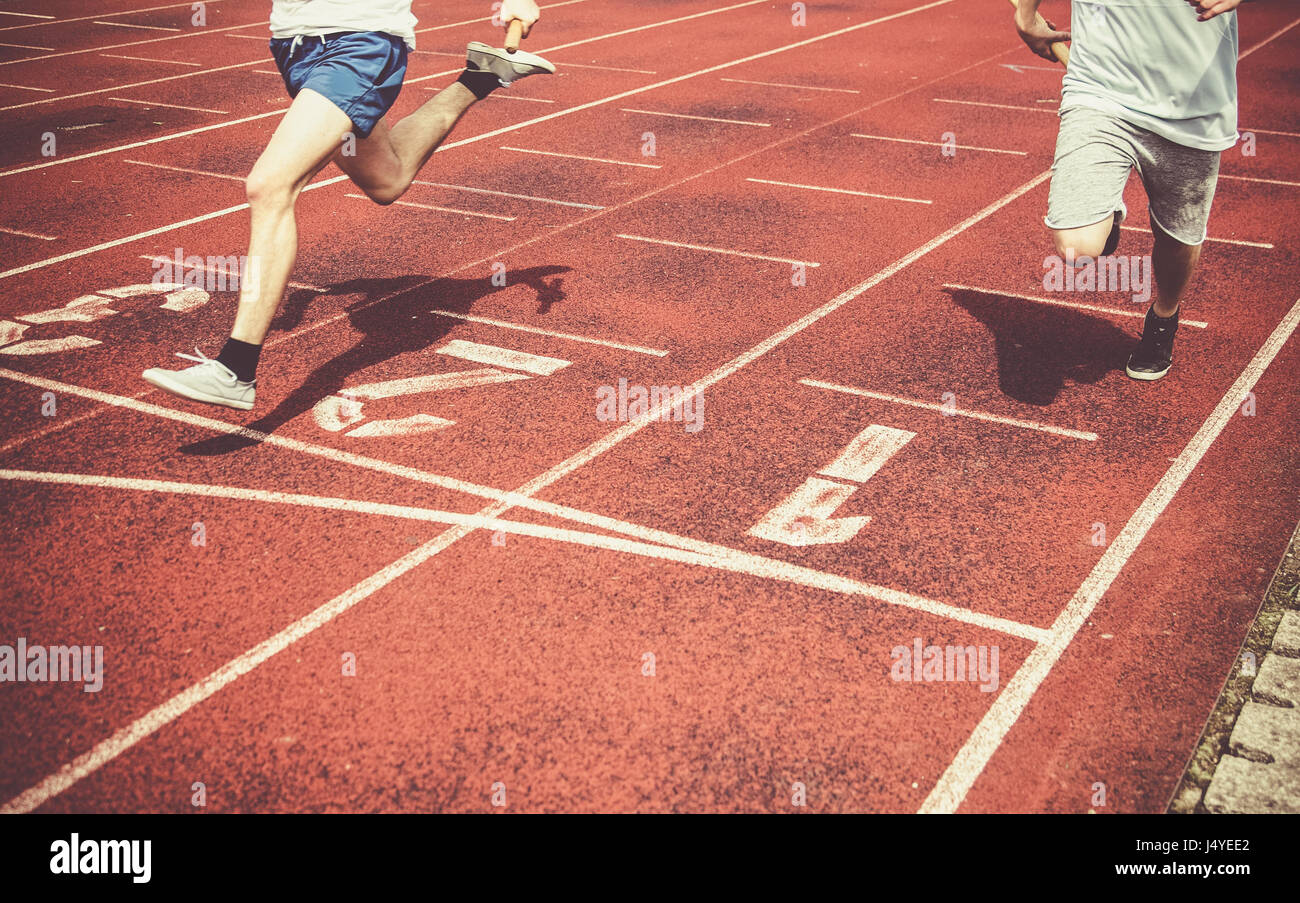 runners approaching the finish line of a race Stock Photo - Alamy