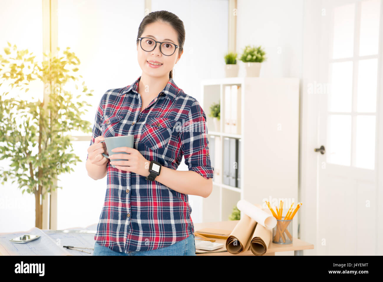 Tall and wise Chinese female engineer architect is happy for her work ...