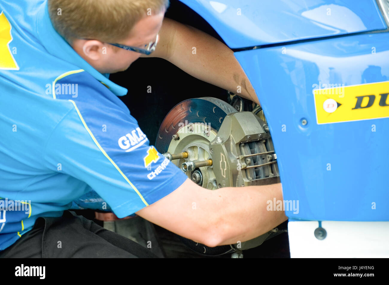 Mechanic working on the Silverline Chevrolet belonging at the British ...