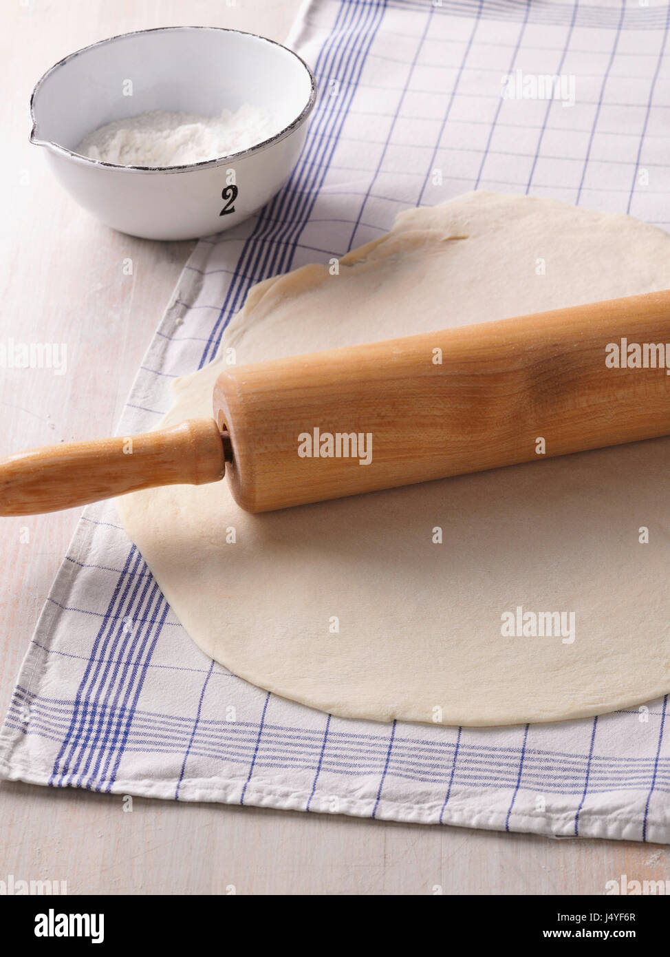 Step Strudel dough: roll out dough on a kitchen towel Stock Photo - Alamy