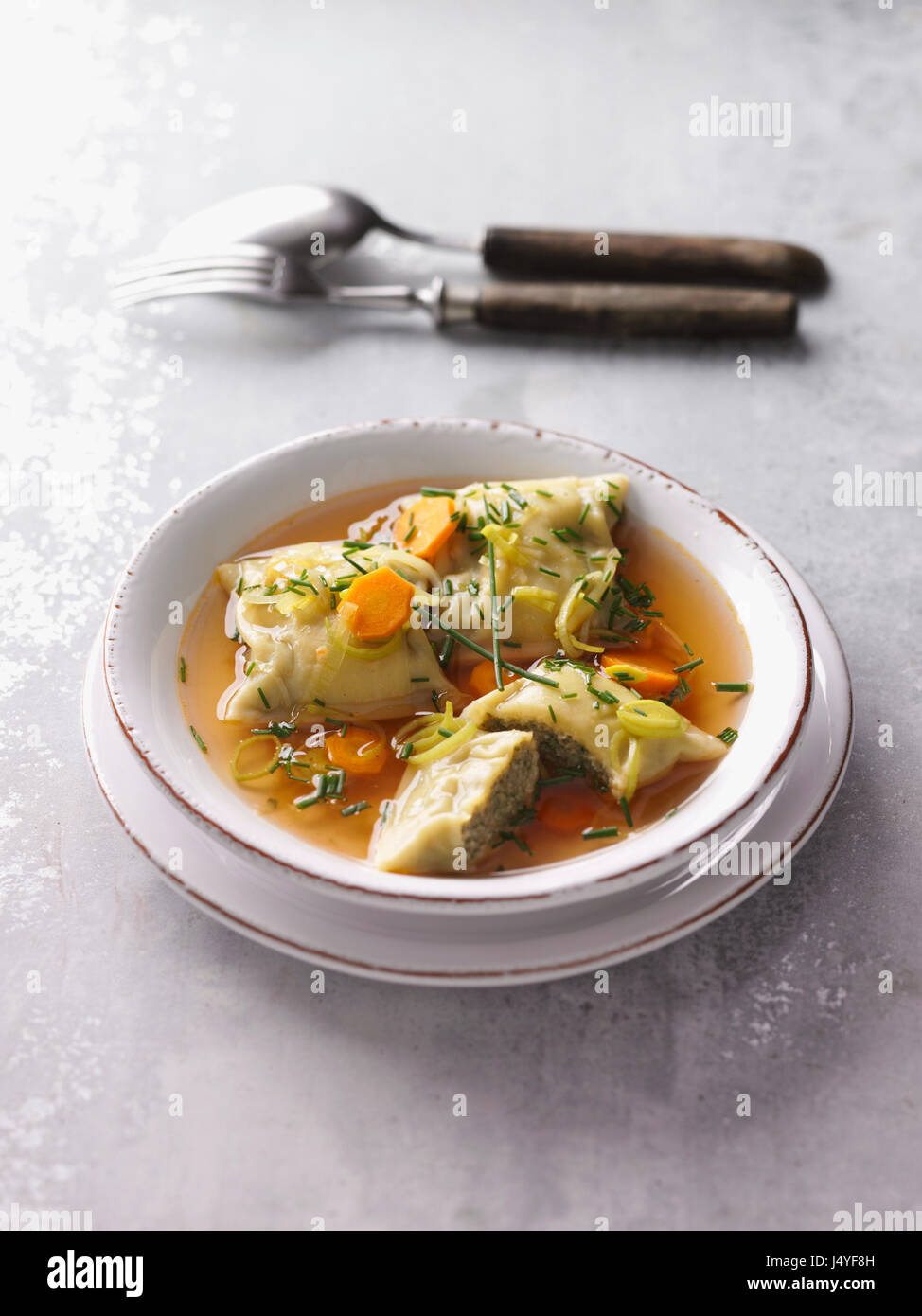 Swabian pockets with herbal minced meat filling Stock Photo - Alamy