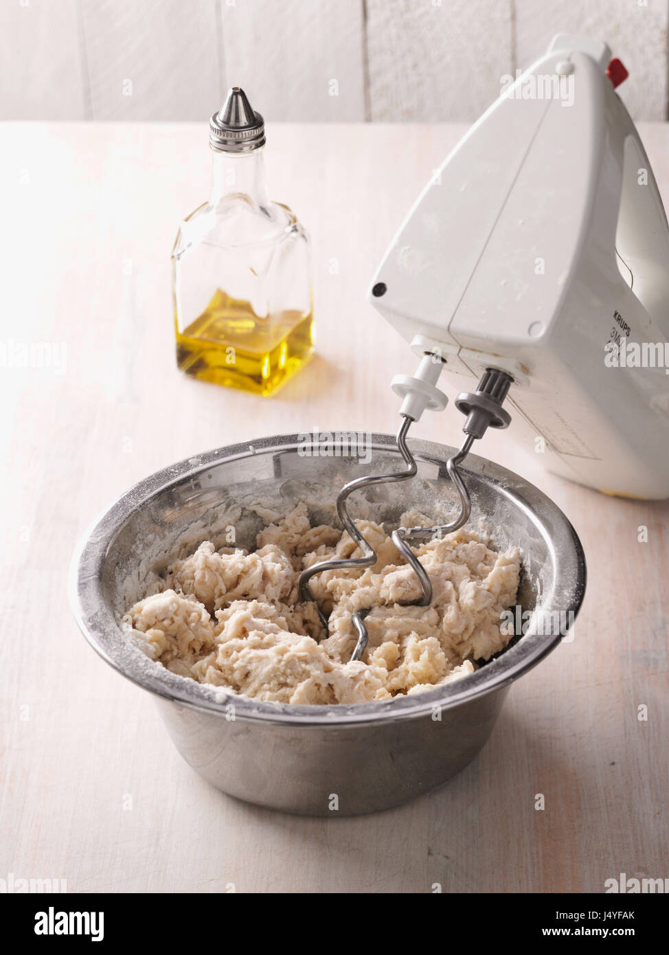 Step Yeast dough: Knead ingredients to a smooth dough Stock Photo - Alamy