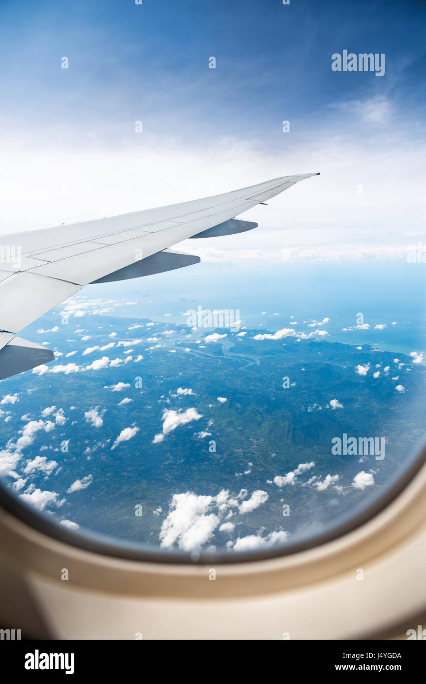 Cloud view through airplane window Stock Photo - Alamy