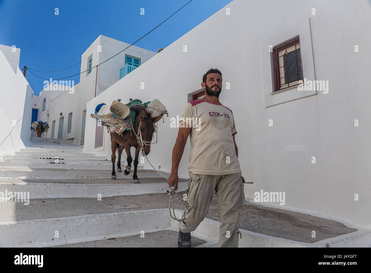 Amorgos Island, Greece - October 2015: Local Greek man with a Donkey ...