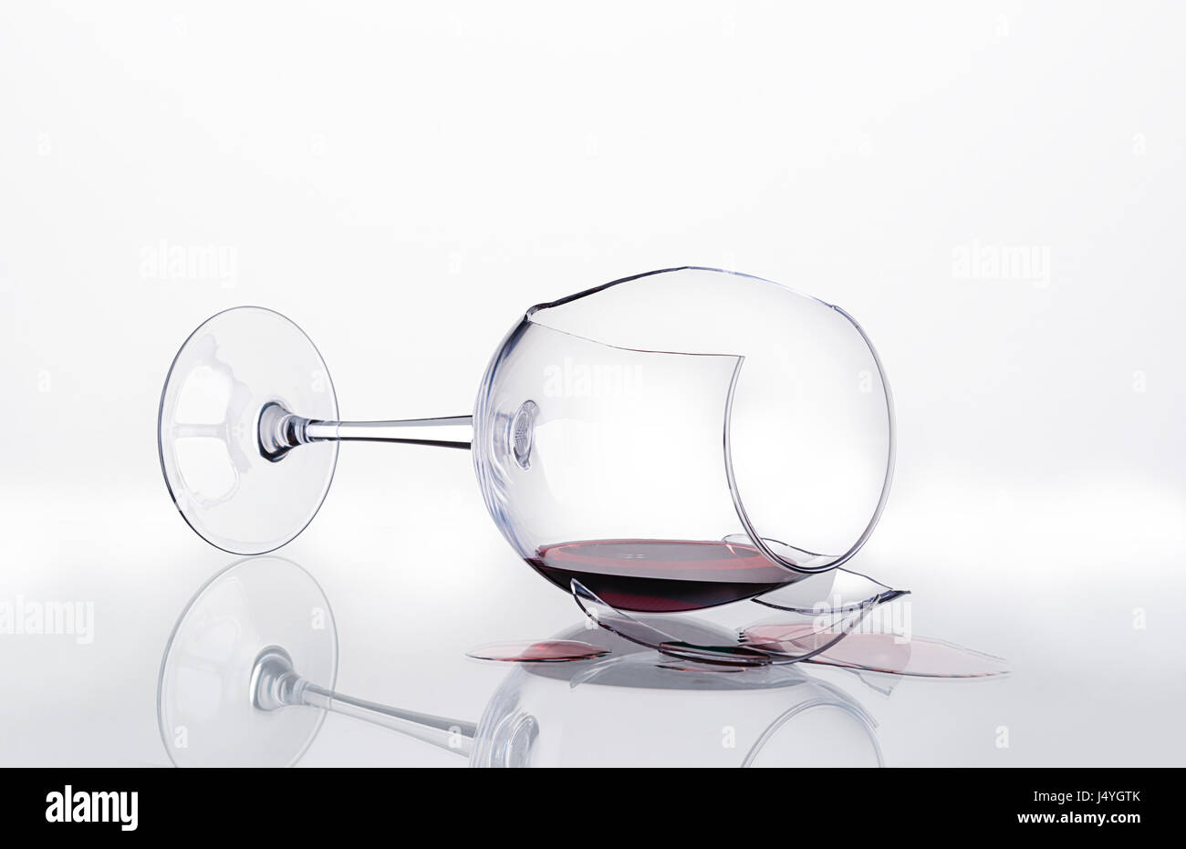 Broken glass of wine Stock Photo - Alamy
