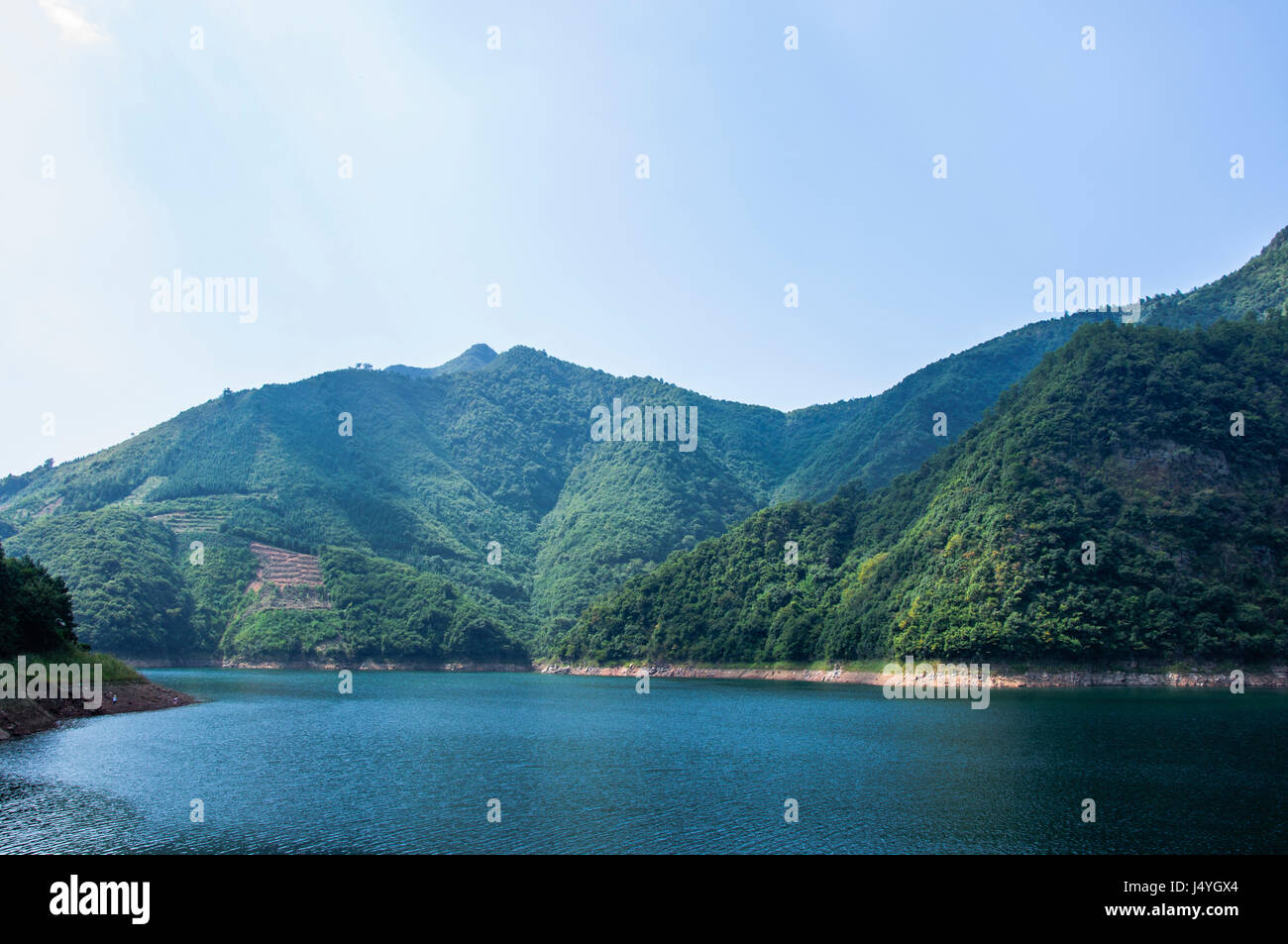 Beautiful reservoir scenery with blue sky in summer Stock Photo - Alamy