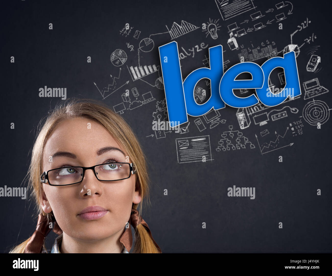 Young girl with glasses thinking Stock Photo - Alamy