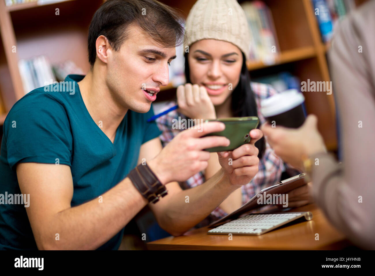 College students looking mobile hi-res stock photography and images - Alamy